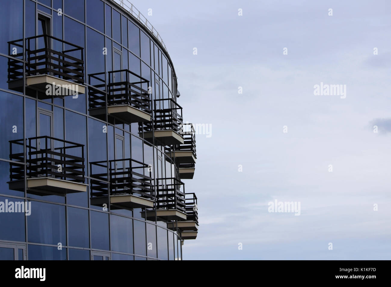 big transparent windows office building on a sky background Stock Photo ...