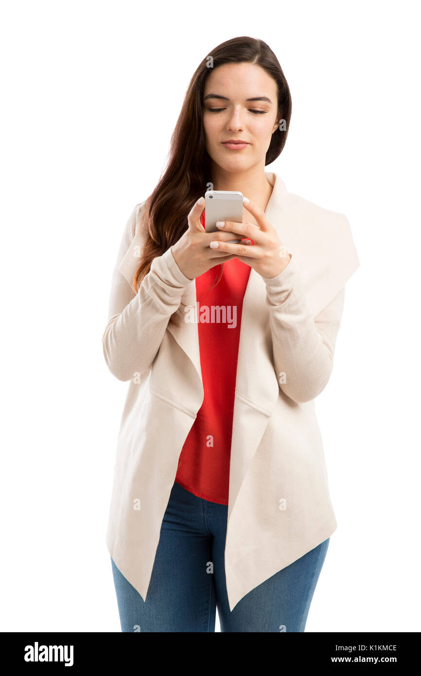 Beautiful woman sending a text message, isolated over white background ...