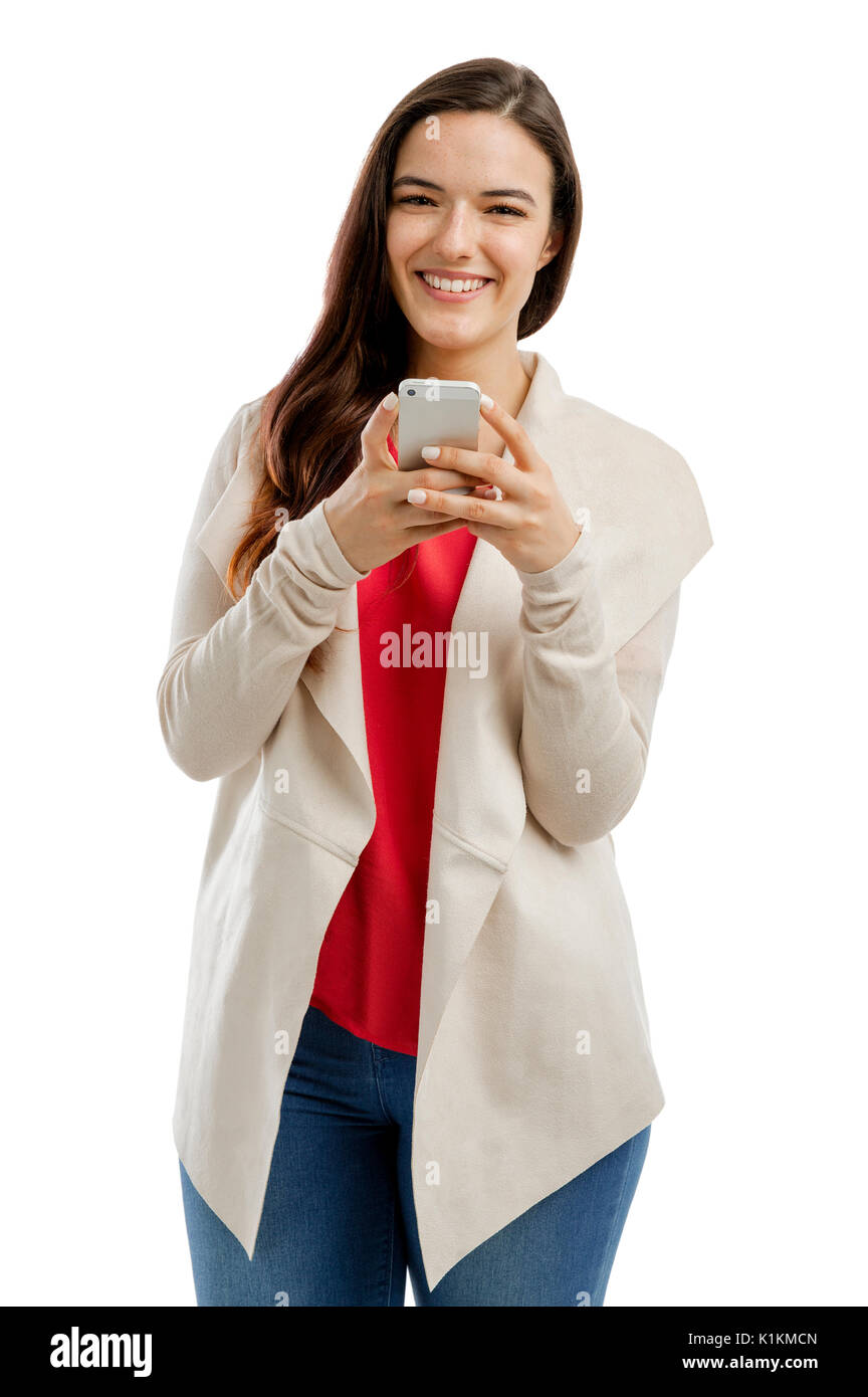 Beautiful woman sending a text message, isolated over white background ...