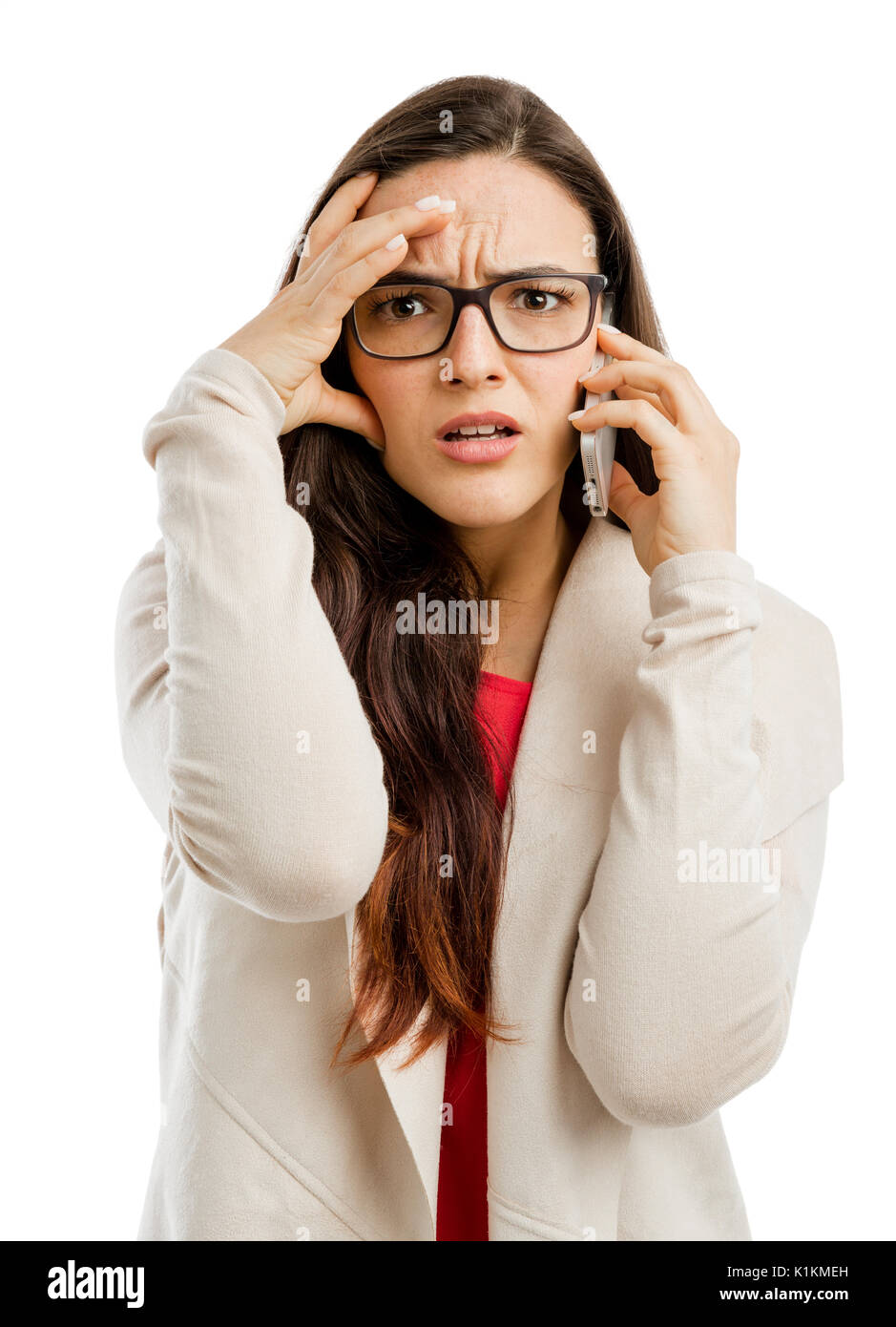 Stressed woman talking on the phone, isolated over white background ...