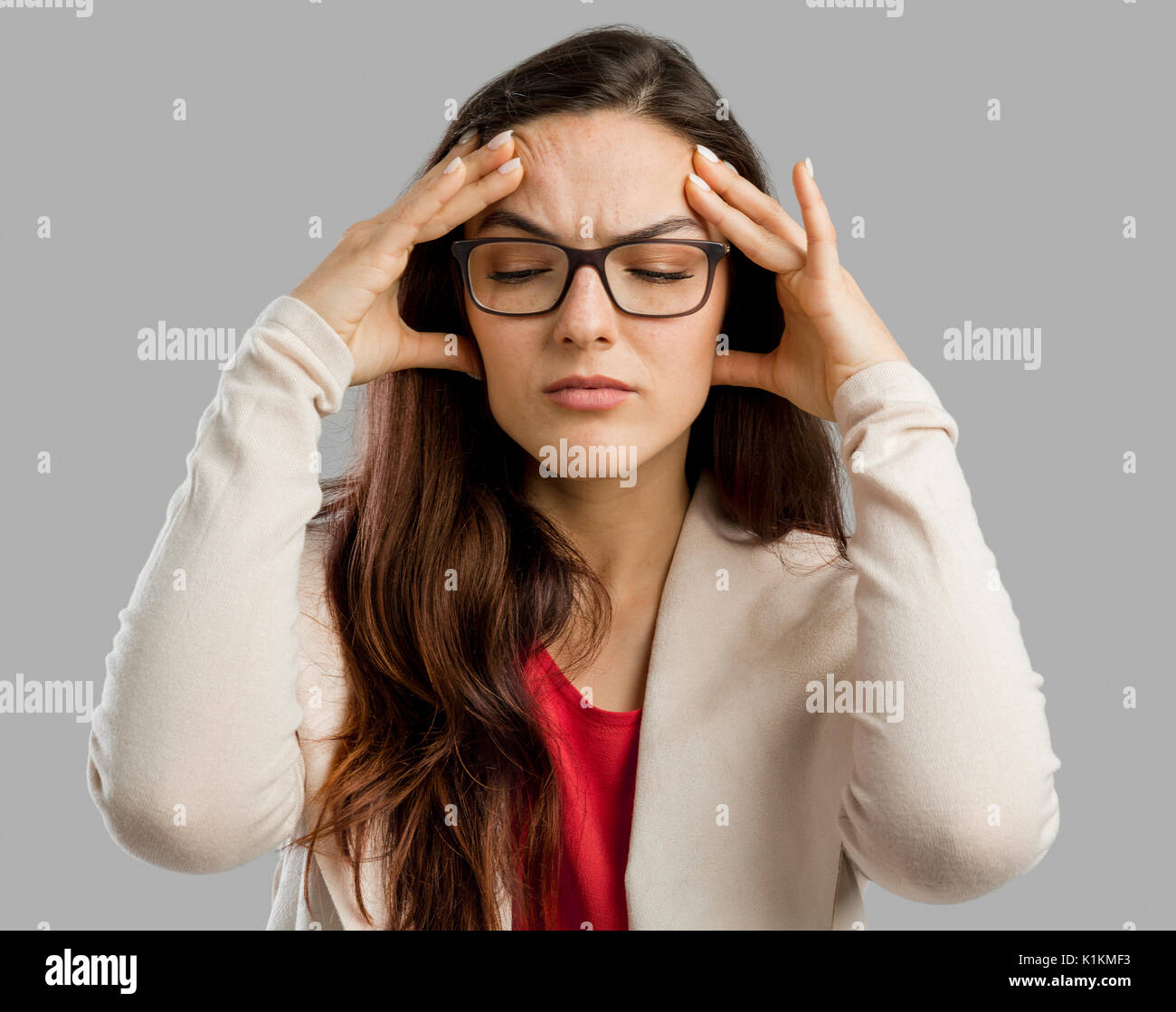 Portrait of a beautiful woman with a headache Stock Photo - Alamy