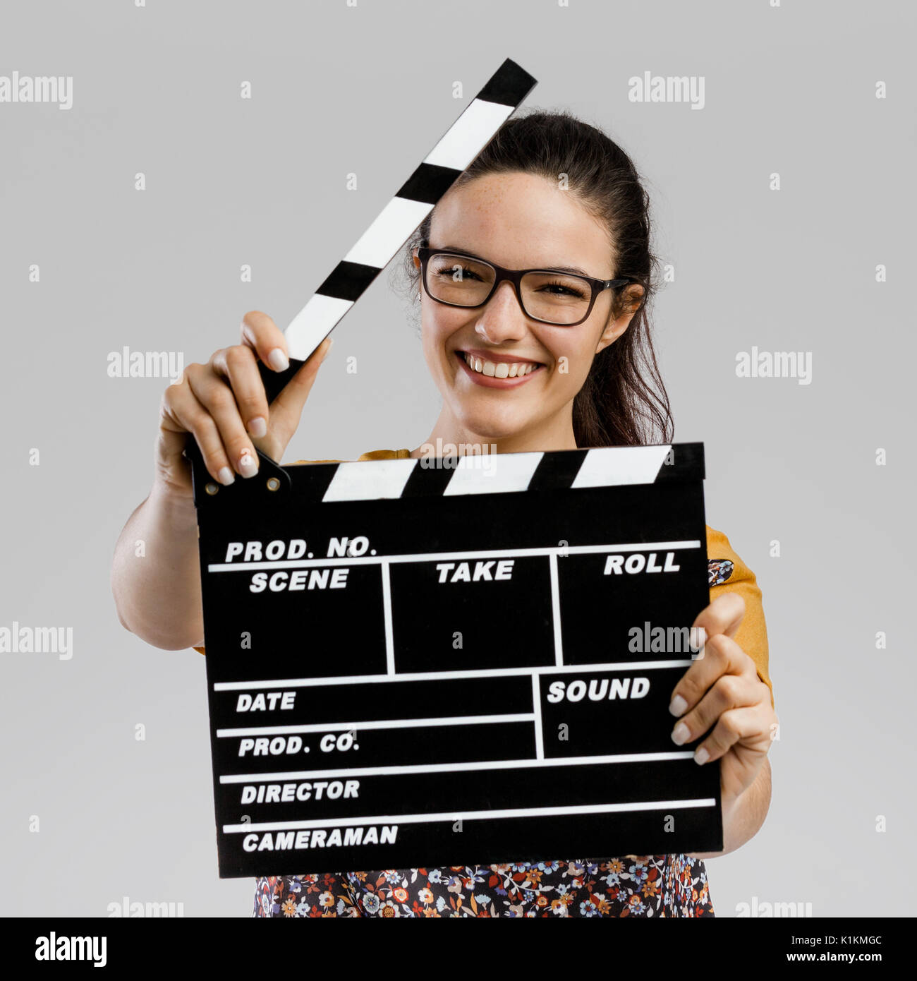 Portrait of beautilful woman holding a clapboard Stock Photo - Alamy Portrait of beautilful woman holding a clapboard Stock Photo - Alamy