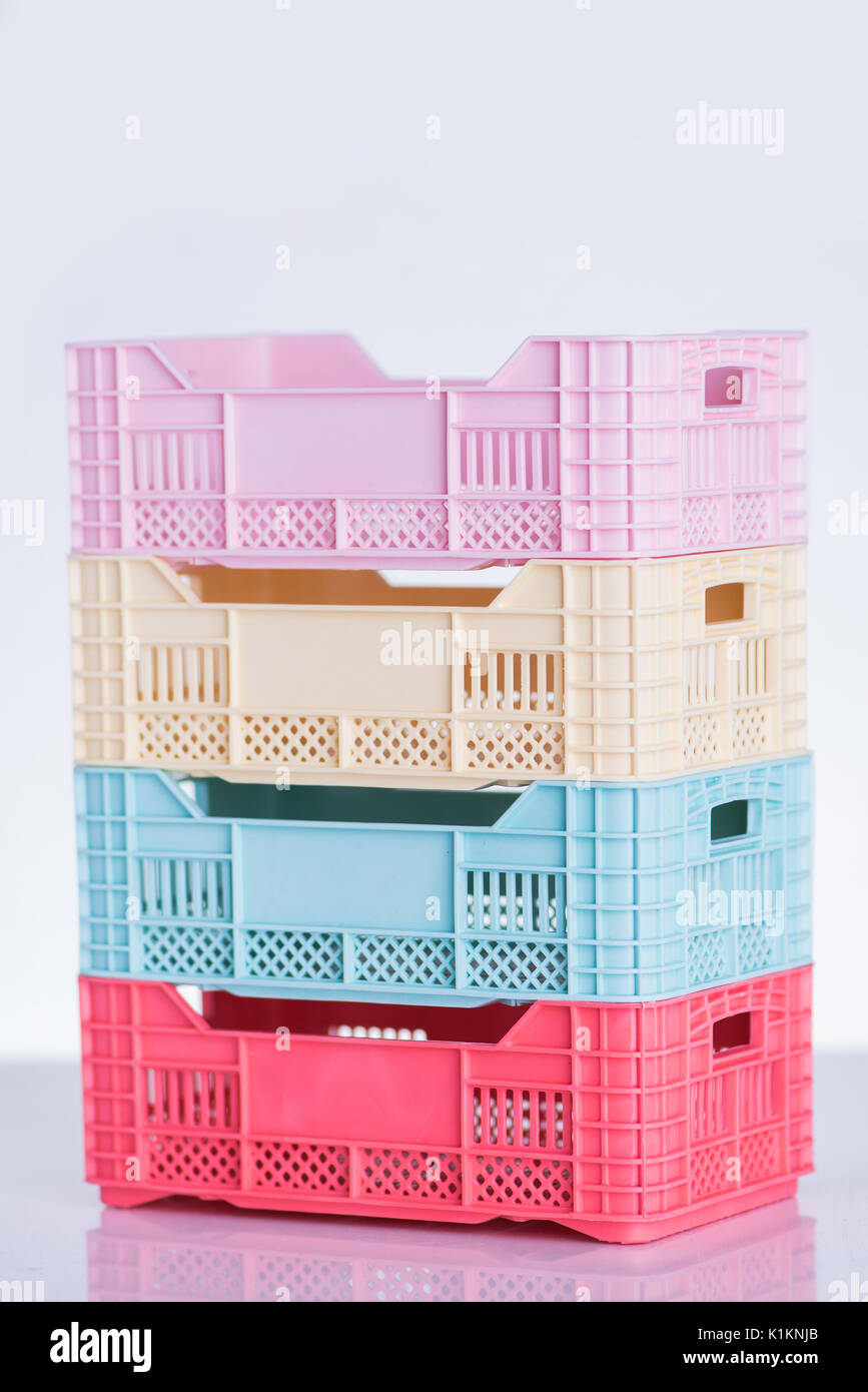 Pastel colored plastic crates Stock Photo - Alamy