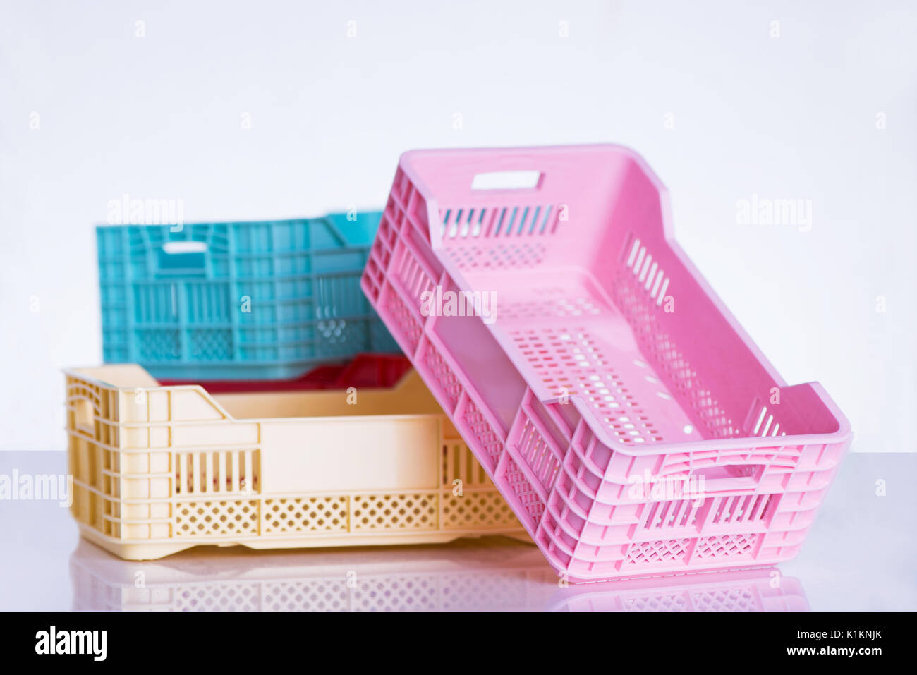 Pastel colored plastic crates Stock Photo - Alamy