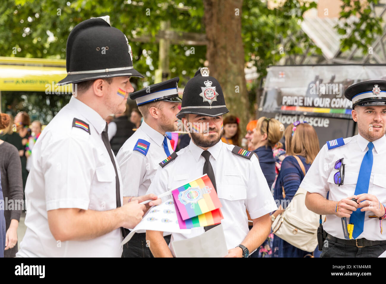 Policemen wearing rainbow face paint support gay rights at the Cardiff ...