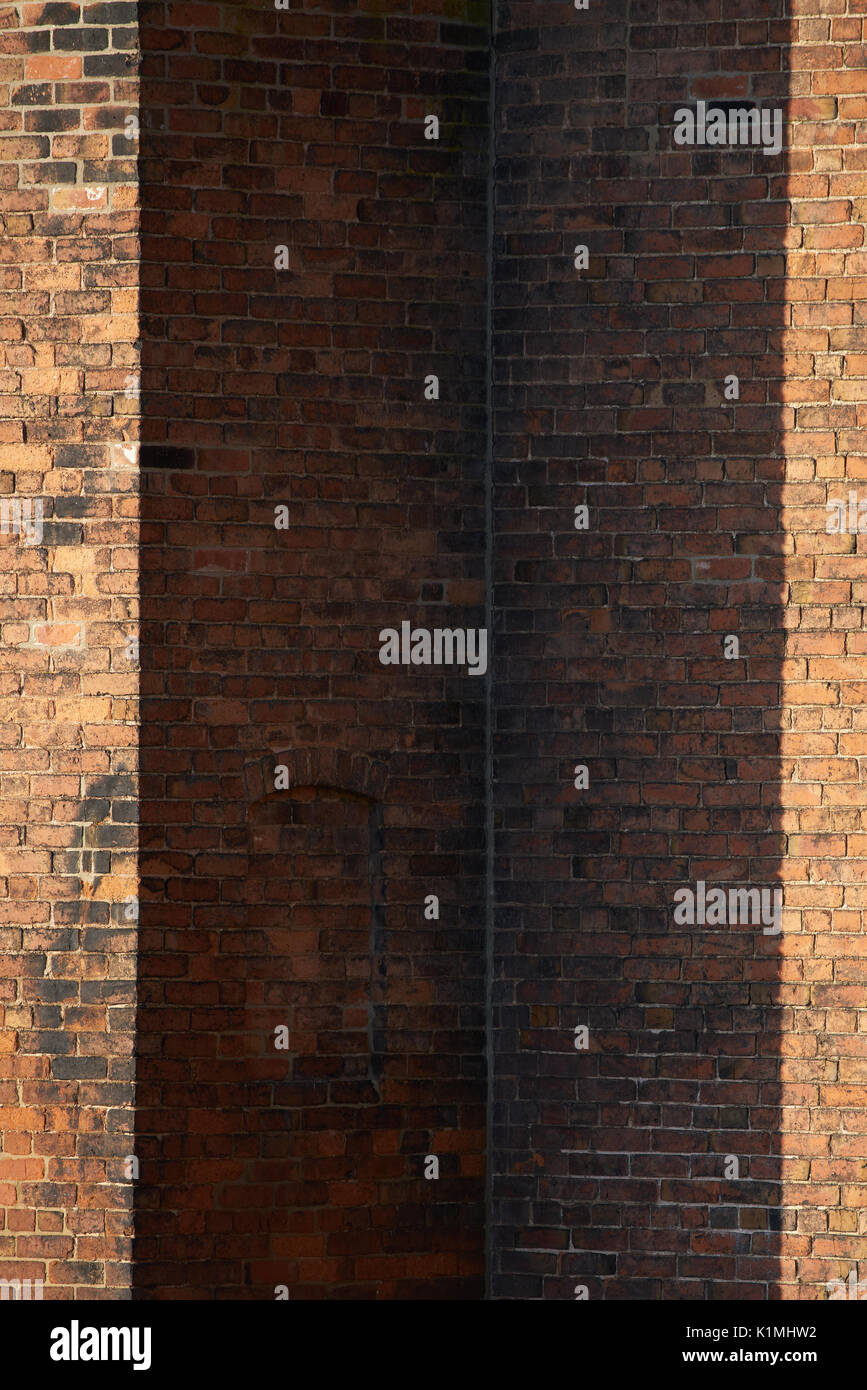 Red brick wall with shadow Stock Photo - Alamy