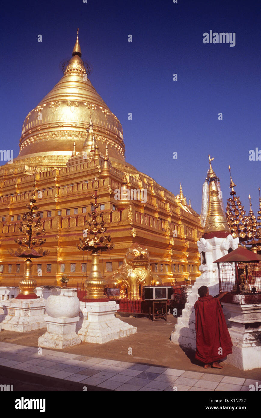 Buddhist monk praying at Shwezigon Pagoda, Pagan (Bagan), Burma ...