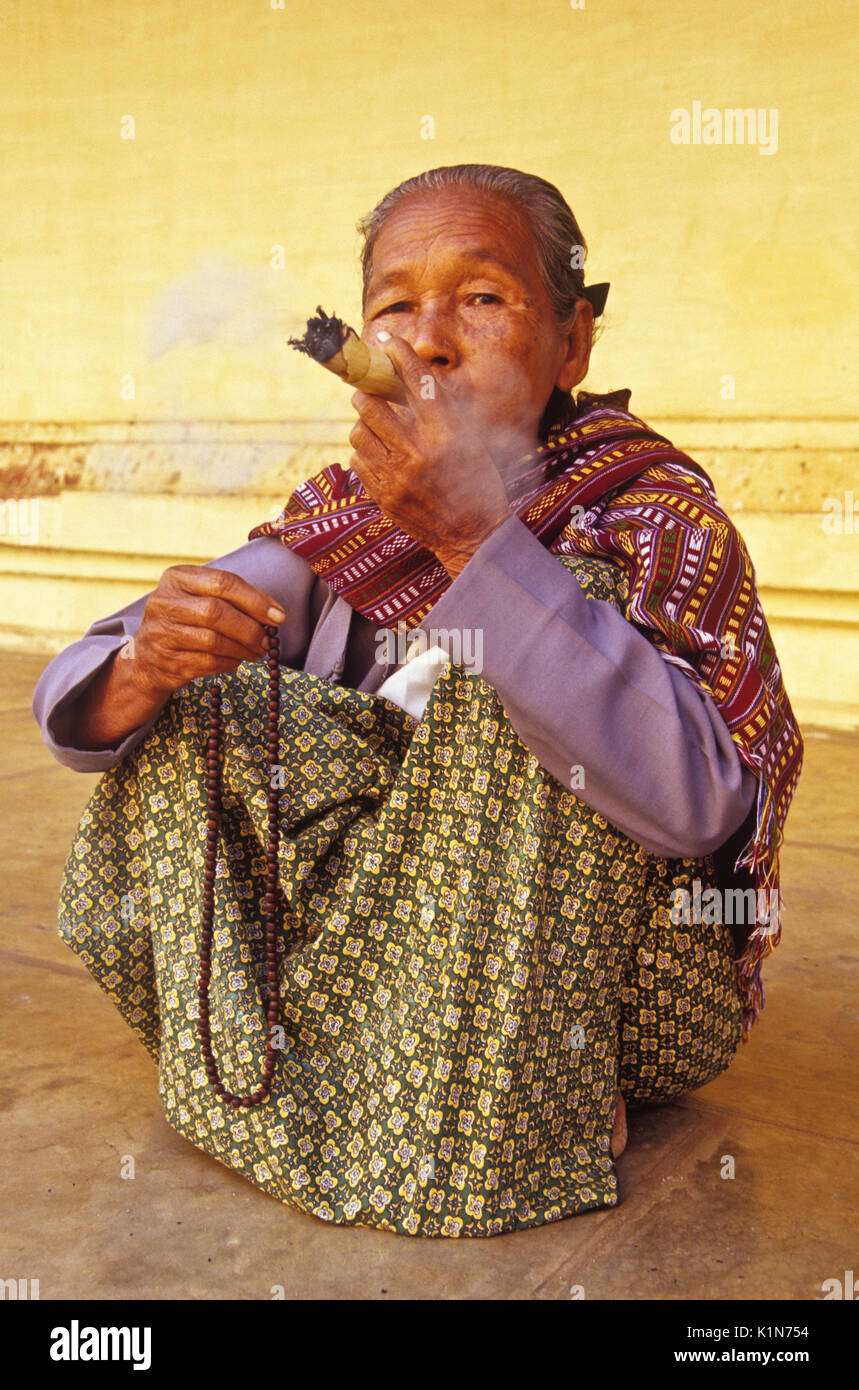 Old woman smoking a cheroot (cigar), Pagan (Bagan), Burma (Myanmar ...