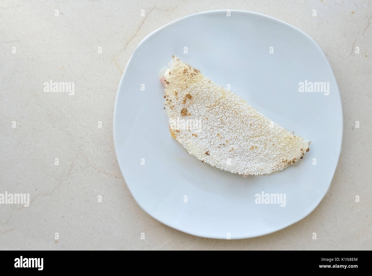 Brazilian typical food from northeast region named "Tapioca" on a white ...