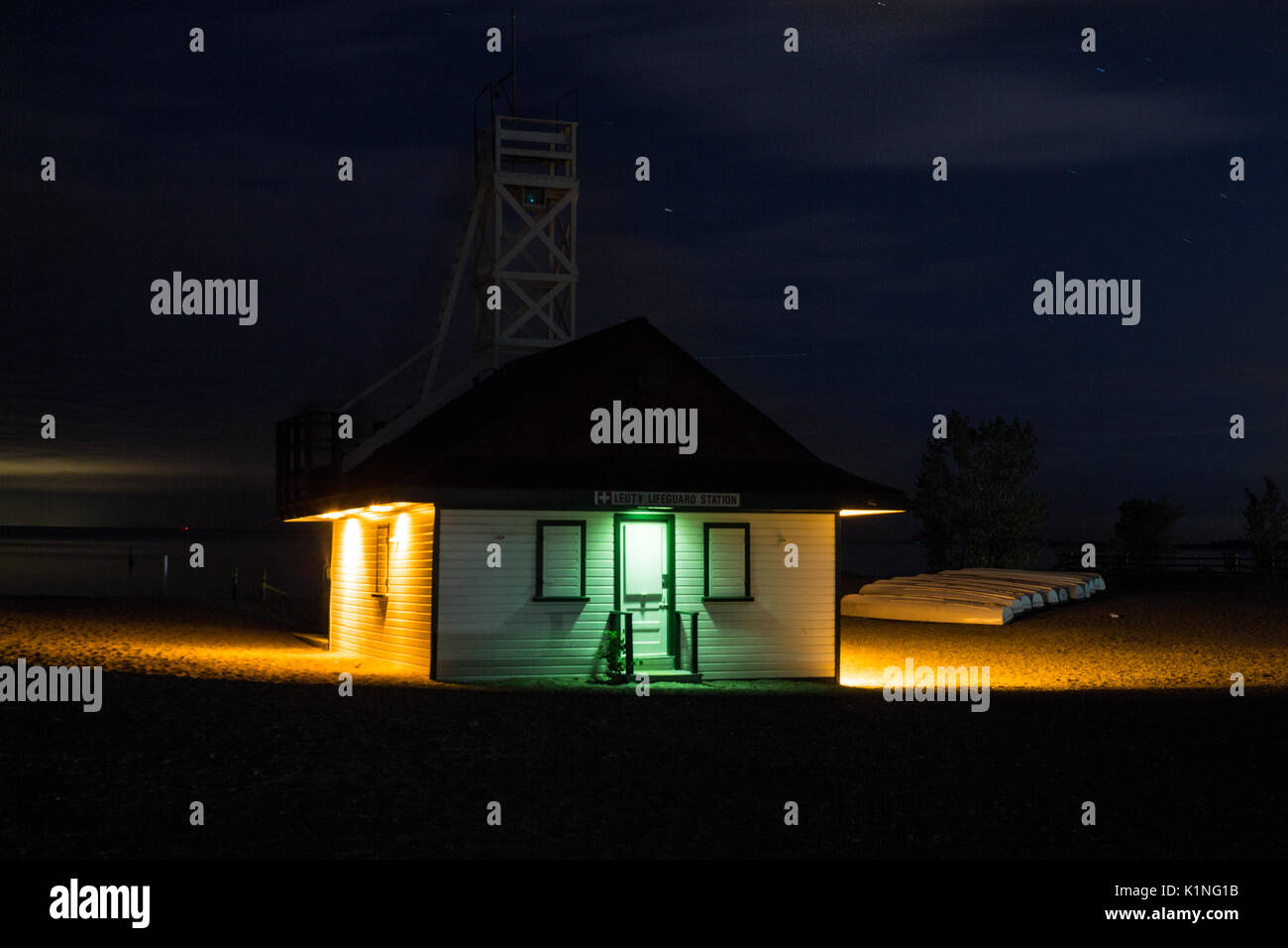 illuminated lifeguard station at a beach at night Stock Photo - Alamy