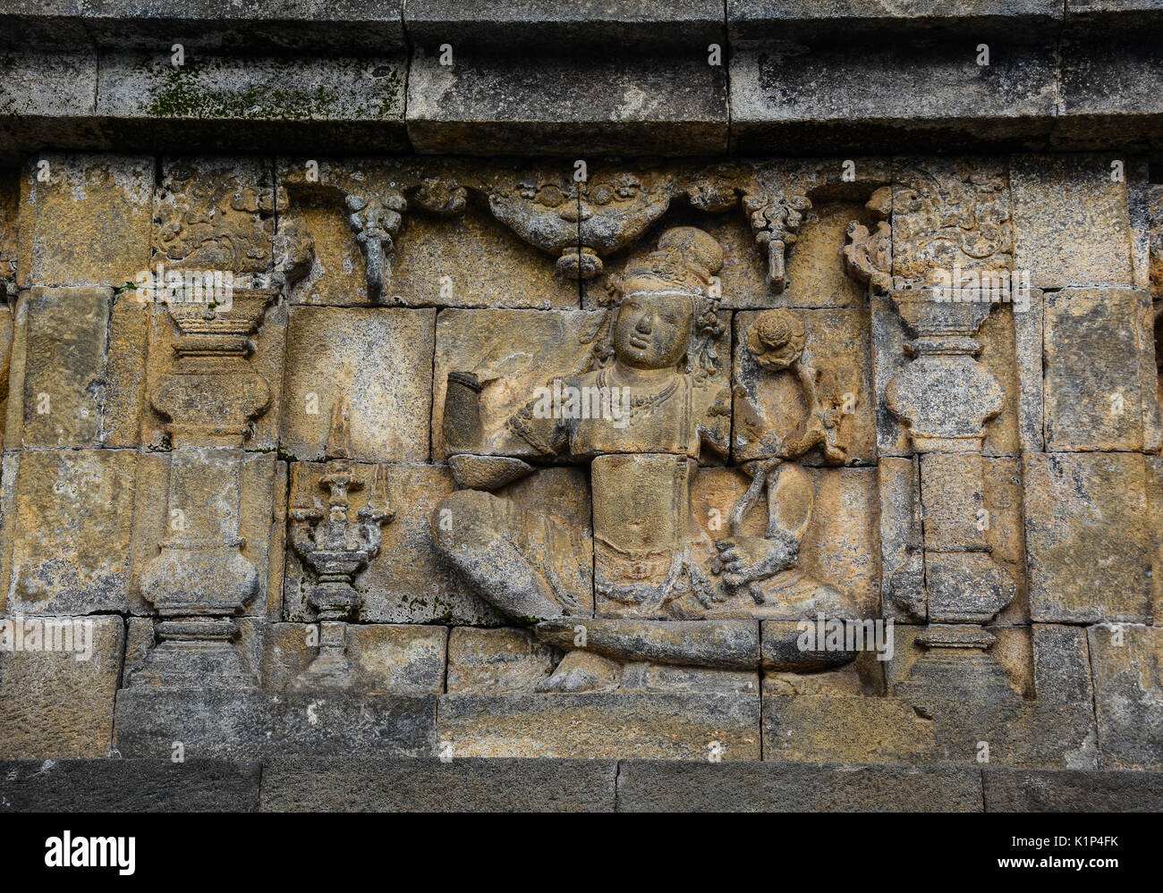 Carved relief at Borobudur on Java, Indonesia. Borobudur is a Buddhist ...