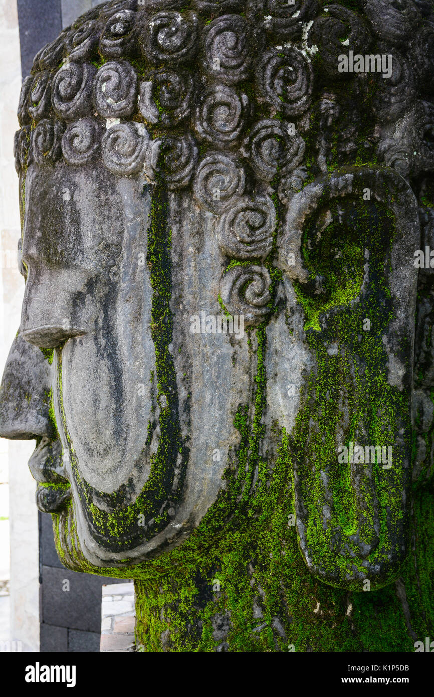 Head of Buddha statue at Borobudur on Java, Indonesia. Built in the 9th ...