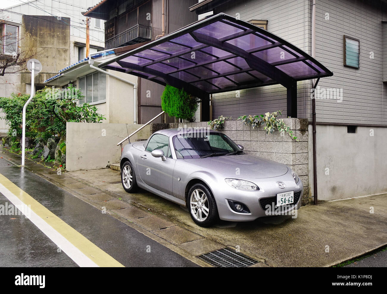 Tokyo, Japan - Nov 27, 2016. Japanese traditional houses with a car at ...