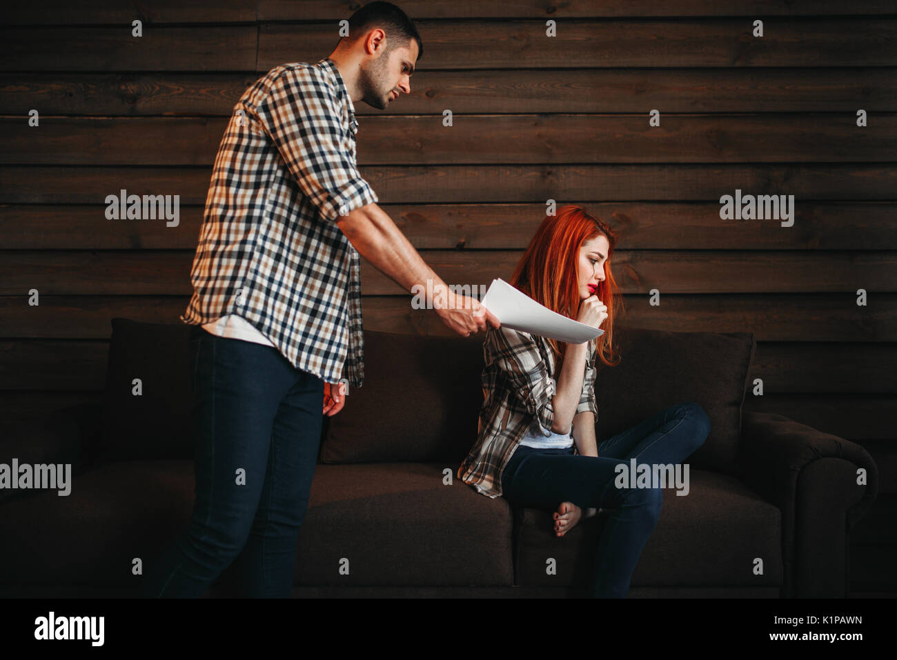 Young woman crying, man leaves the house, family quarrel, couple in ...