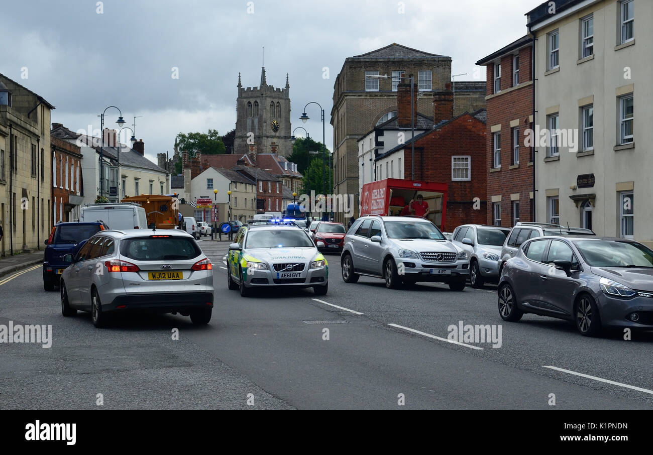 An ambulance car threading its way through traffic while attending to ...