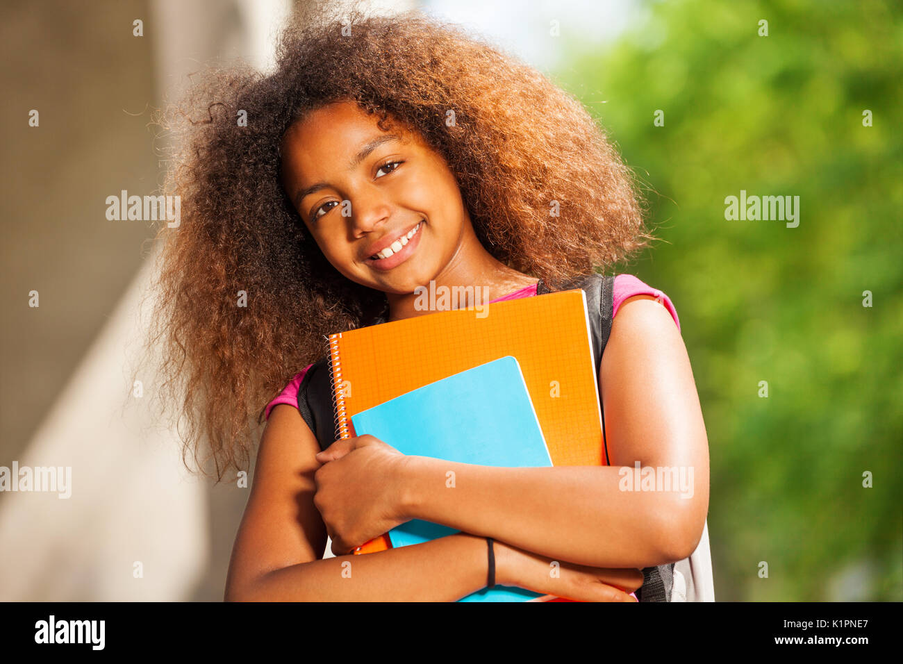 Close portrait of beautiful French girl with textbooks smiling Stock ...