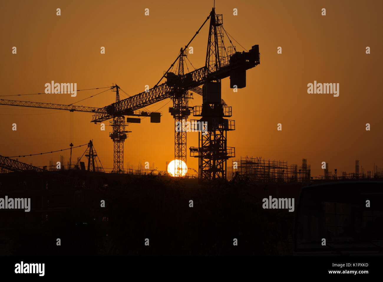Construction site at sunset Stock Photo - Alamy