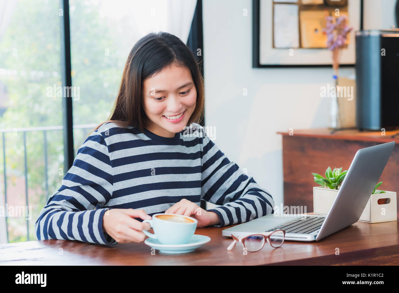 Laptop asian woman coffee hi-res stock photography and images - Alamy
