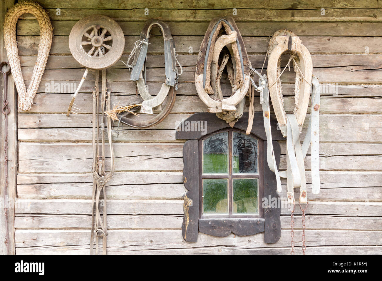 Old wooden house wall with old tools and stuff Stock Photo - Alamy