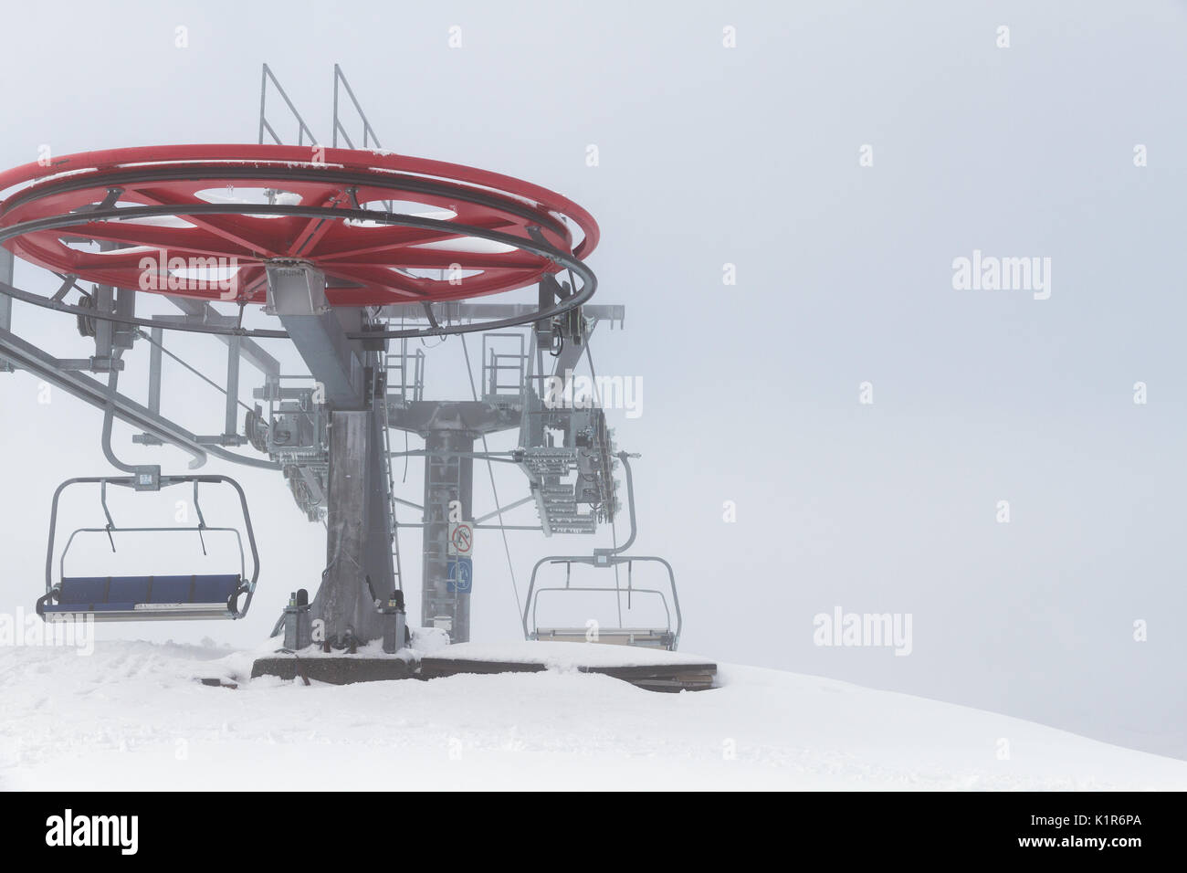 Ski lift chair engine by misty snowy day in mountains area Stock Photo ...