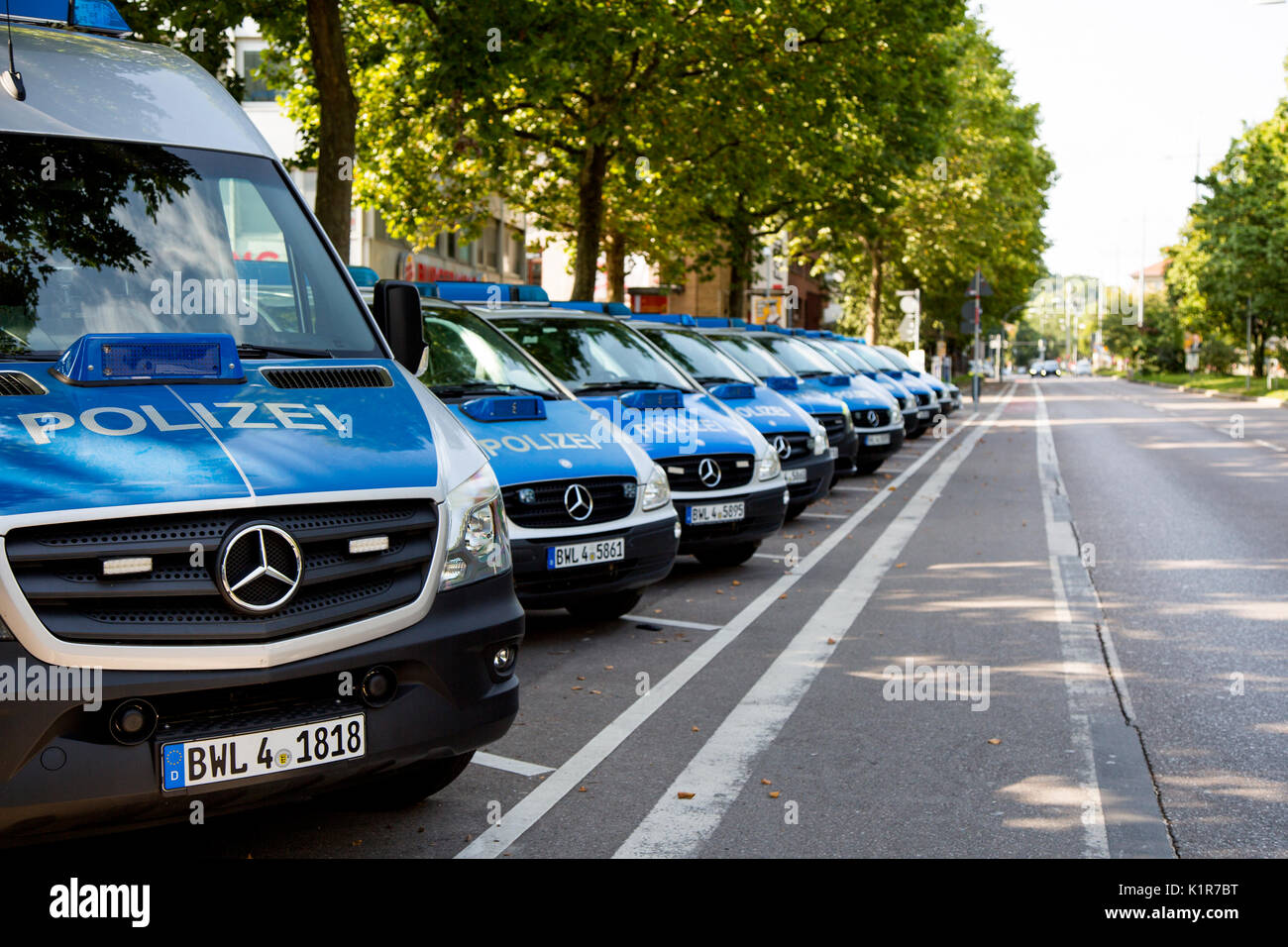 A line of Mercedes police cars parked outside a place station on a ...