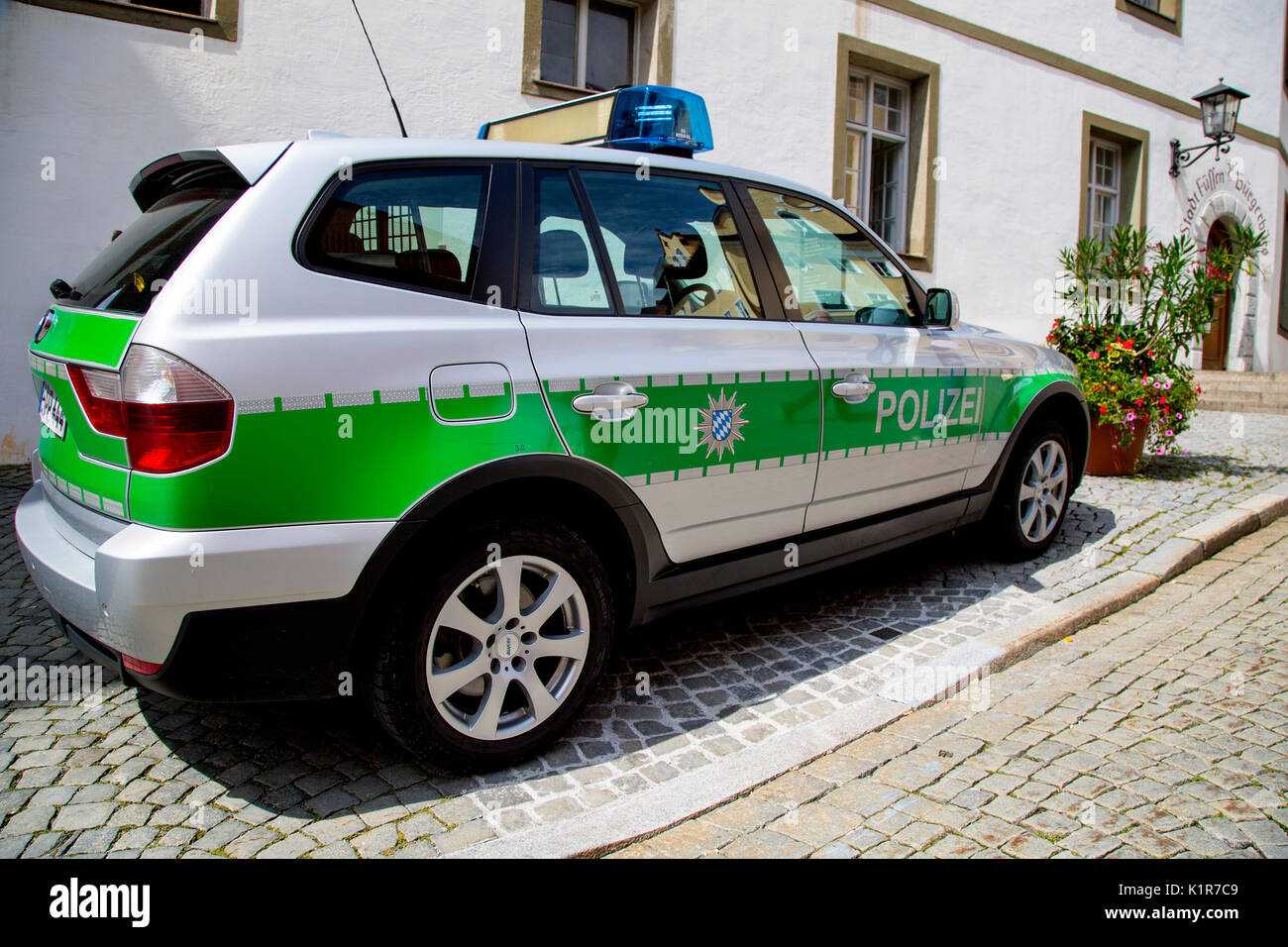 A BMW police car parked on a street in Fussen in Allgau, Bavaria ...