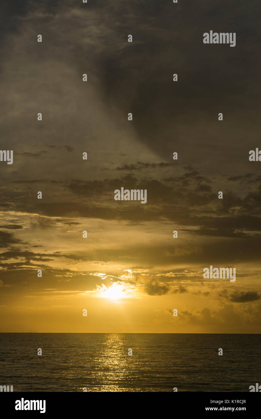 Dramatic sunset over tropical sea Stock Photo - Alamy