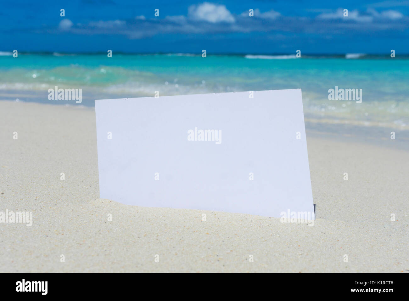 Blank white sign on a tropical summer beach Stock Photo - Alamy