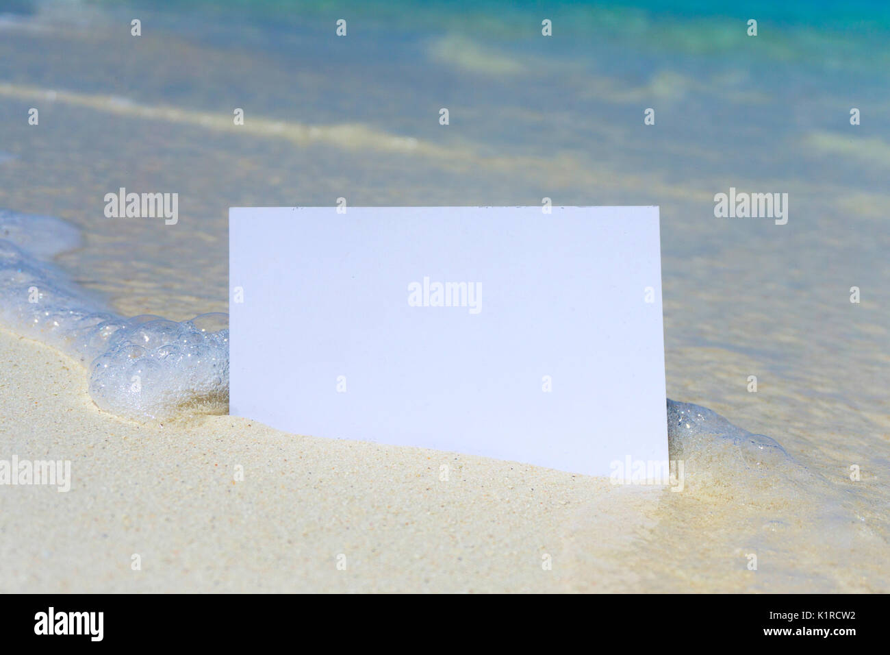 Blank white sign on a tropical summer beach Stock Photo - Alamy