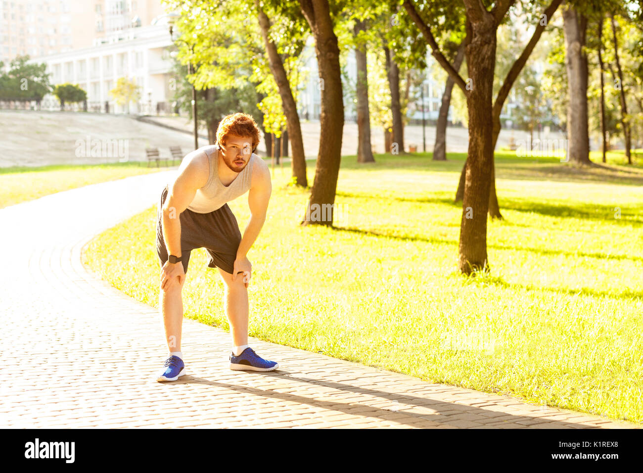 Man running watch park hi-res stock photography and images - Alamy
