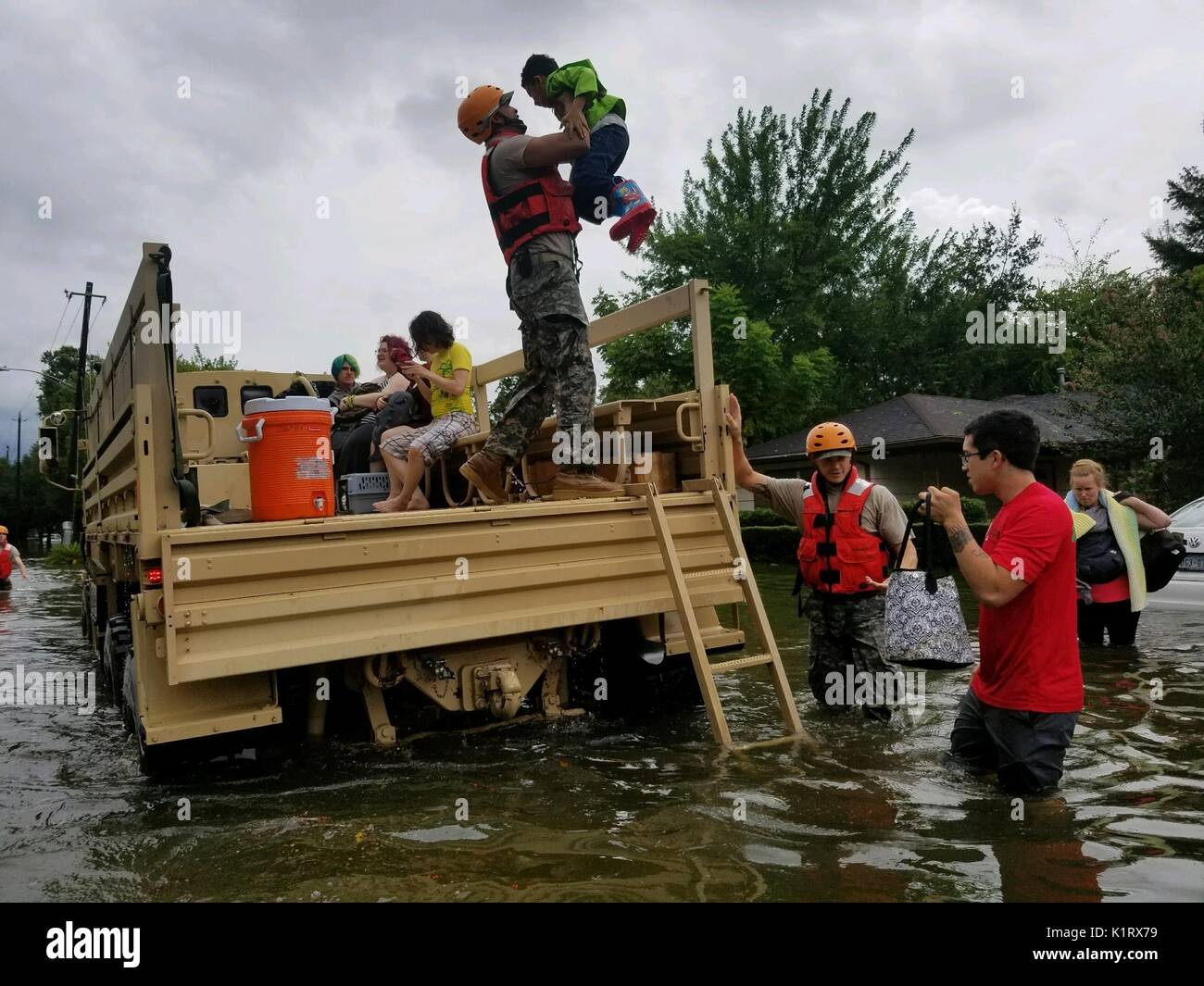 National guardsmen rescue stranded residents after massive flooding ...
