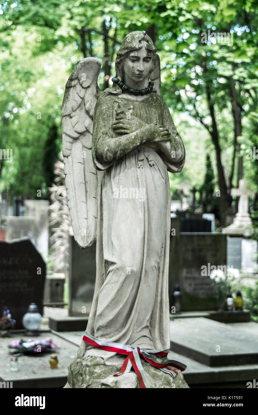 Poland, Warsaw: Statue of an angel at the Powazki Cemetery, the oldest ...