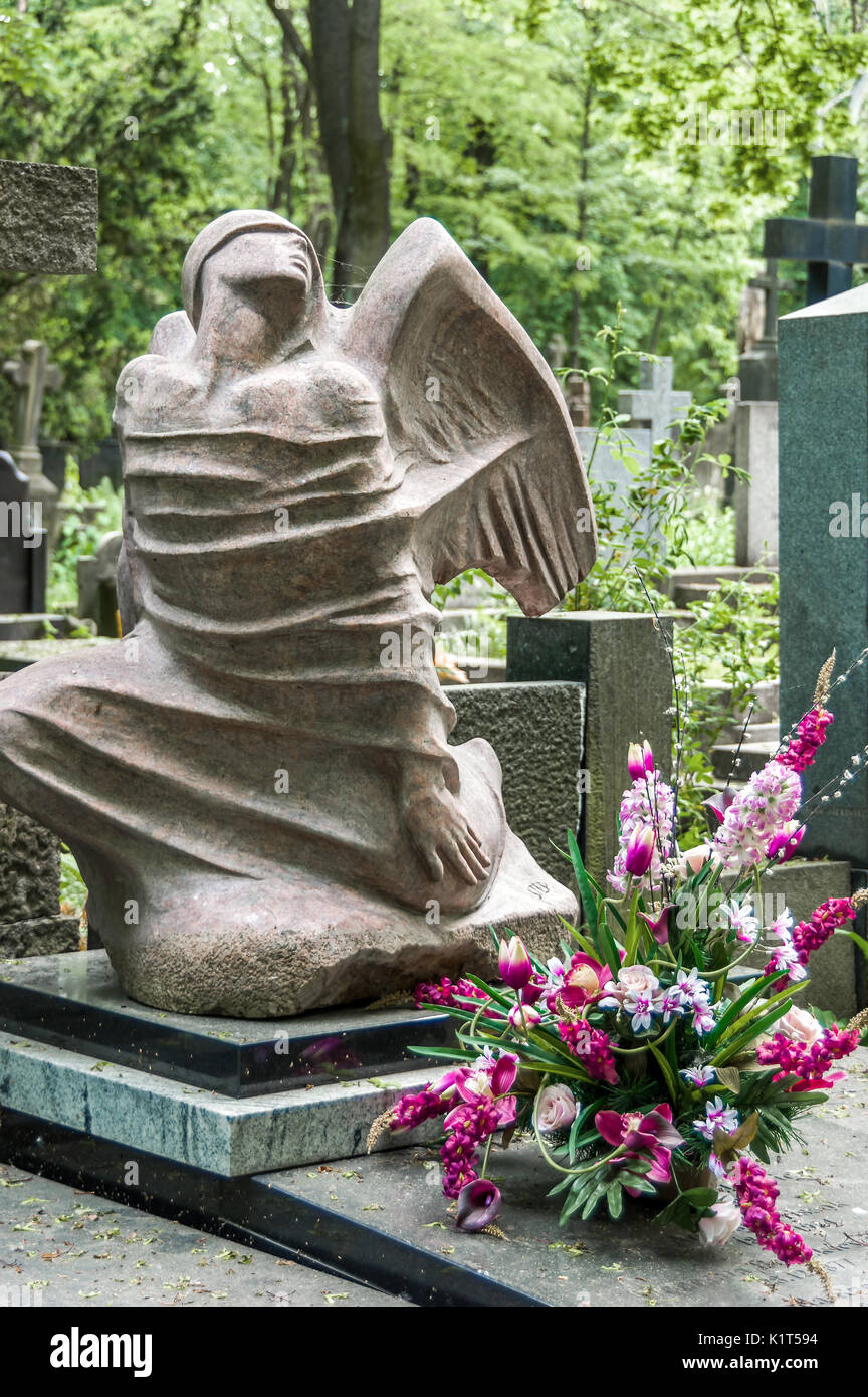 Poland, Warsaw: Statue of an angel at the Powazki Cemetery, the oldest ...