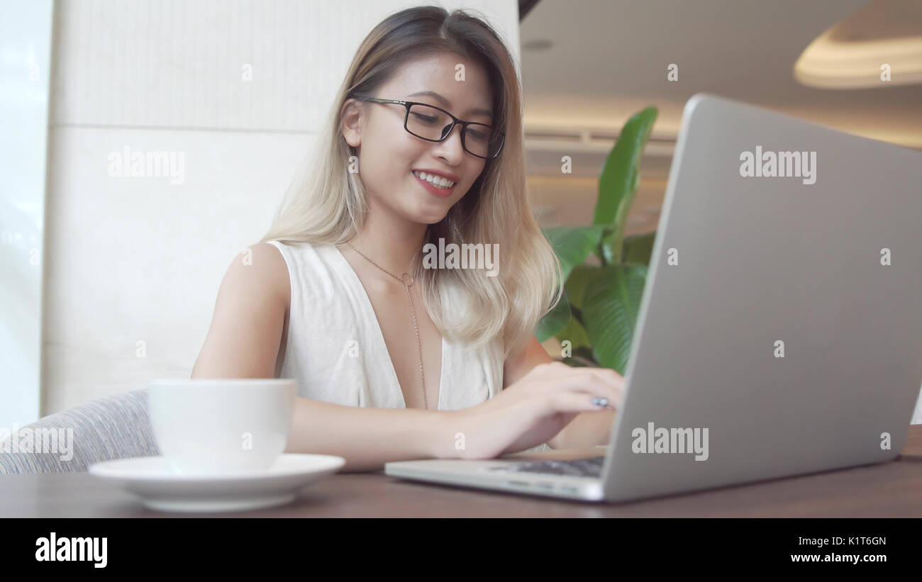 Asian businesswoman using computer Stock Photo - Alamy