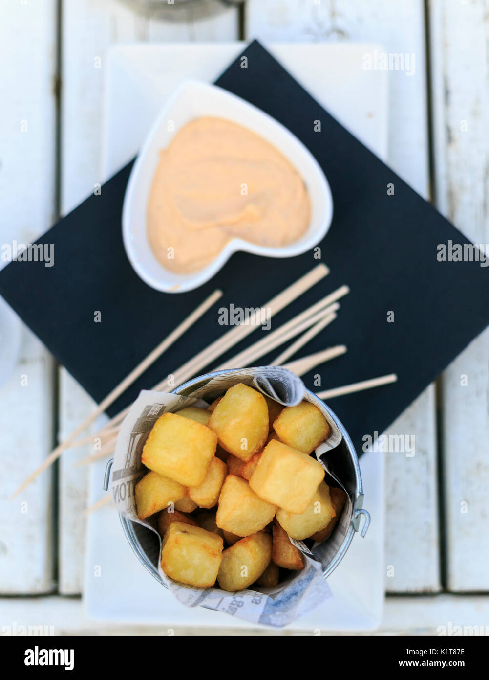 Traditional tapa from Spain. Cube bravas potatoes Stock Photo - Alamy