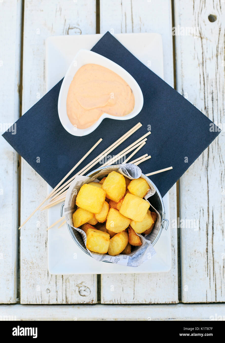 Traditional tapa from Spain. Cube bravas potatoes Stock Photo - Alamy