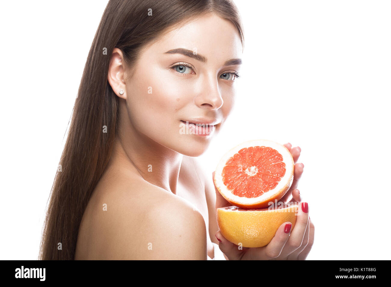 Beautiful young girl with a light natural make-up and perfect skin with ...