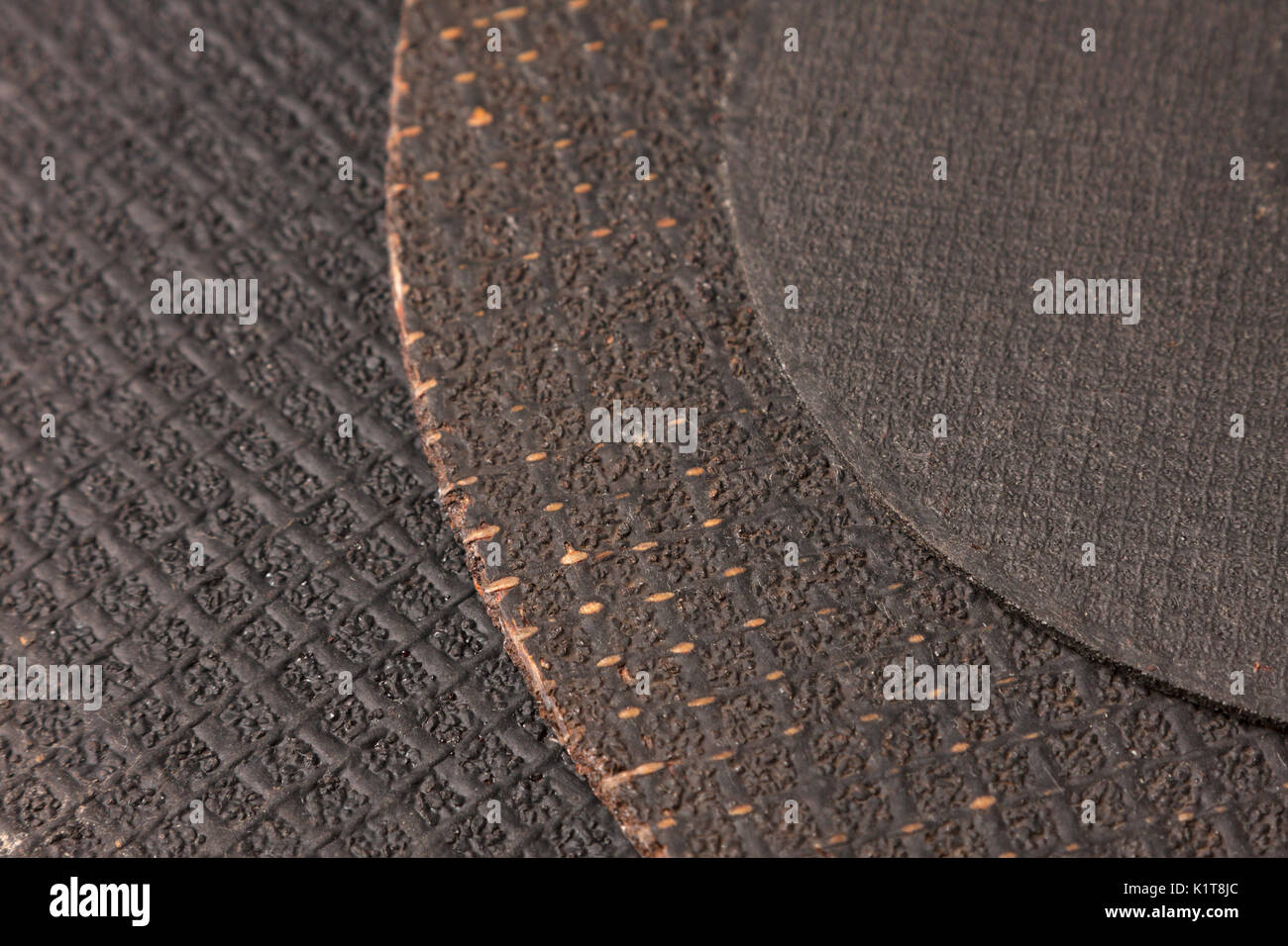 Texture of three cutting discs over metal lying on top of each other ...