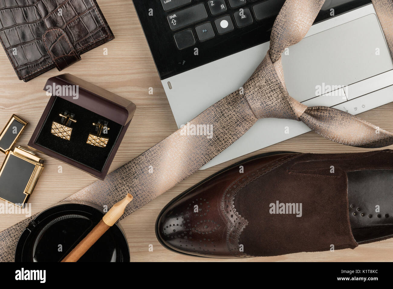 Fashion and business, notebook, shoes, cufflinks, cigar and tie on a ...
