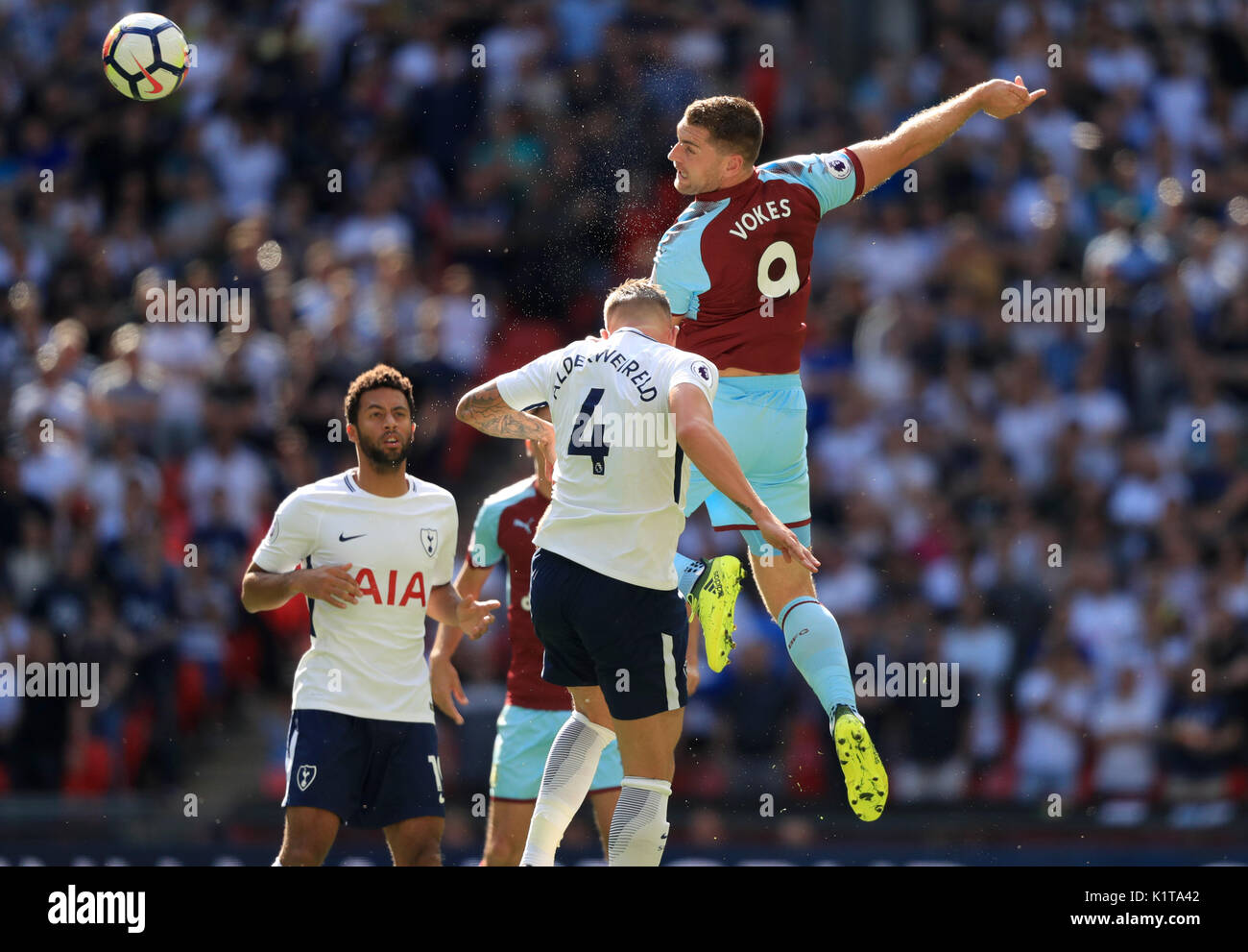 Burnley's Sam Vokes (right) heads the ball during the Premier League ...