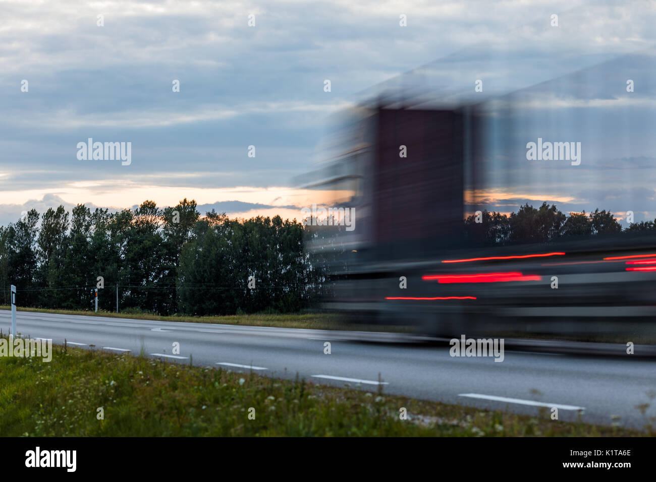 Speeding motion blur oncoming trucks with glowing lights on the highway ... Speeding motion blur oncoming trucks with glowing lights on the highway ...