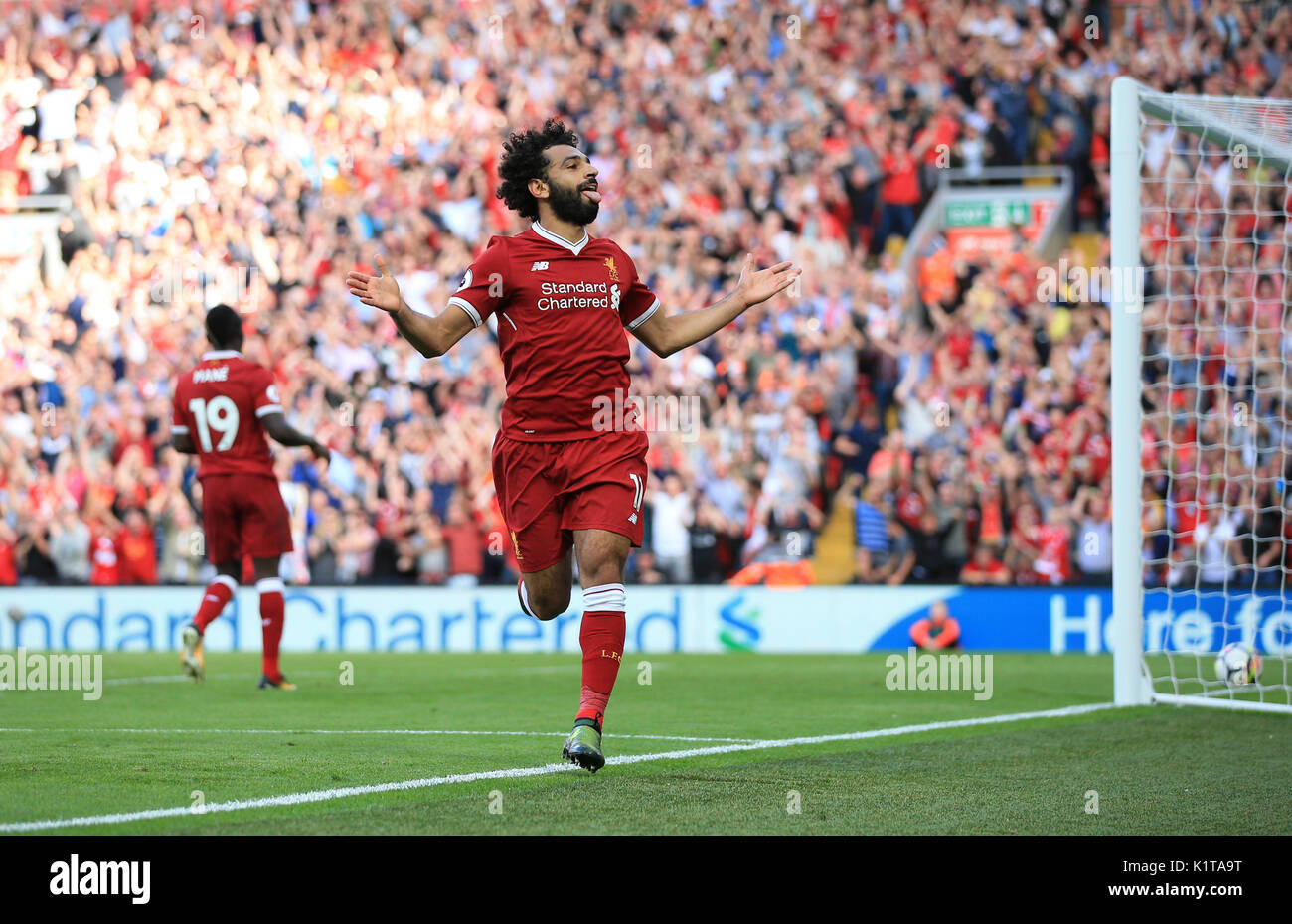 Liverpool's Mohamed Salah celebrates scoring his side's third goal of ...