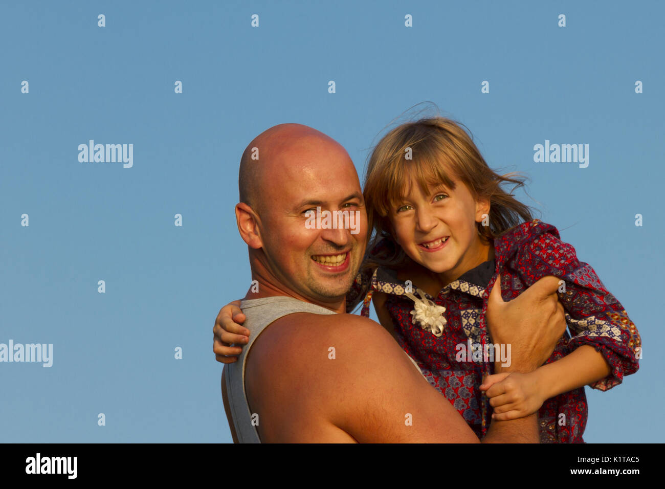 Father carrying daughter in his hands protecting her outdoor Stock Photo - Alamy