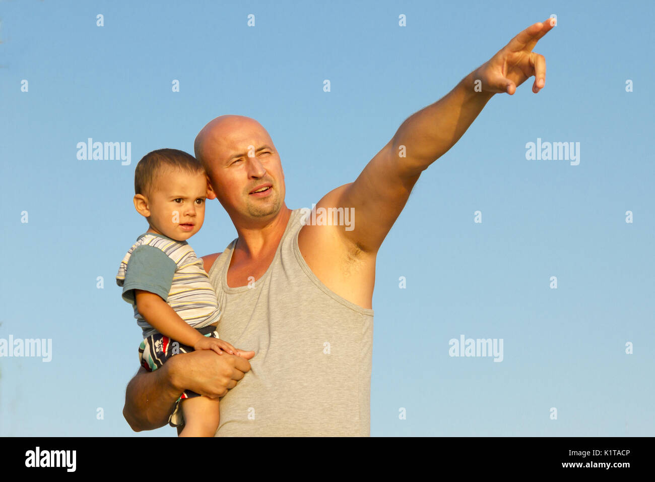 Father plays and has fun with his baby daughter. Concept photo of ...