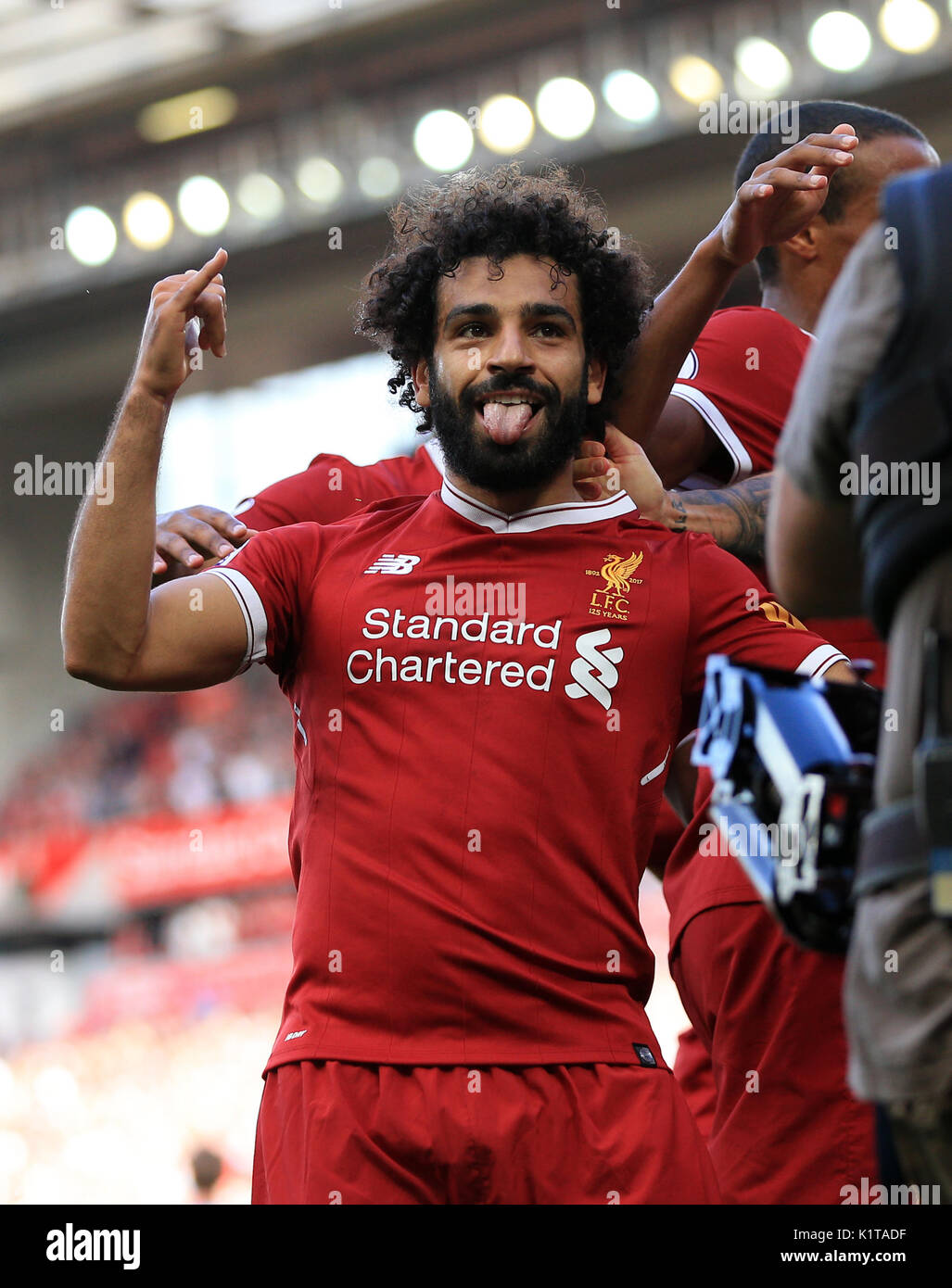 Liverpool's Mohamed Salah celebrates scoring his side's third goal of ...