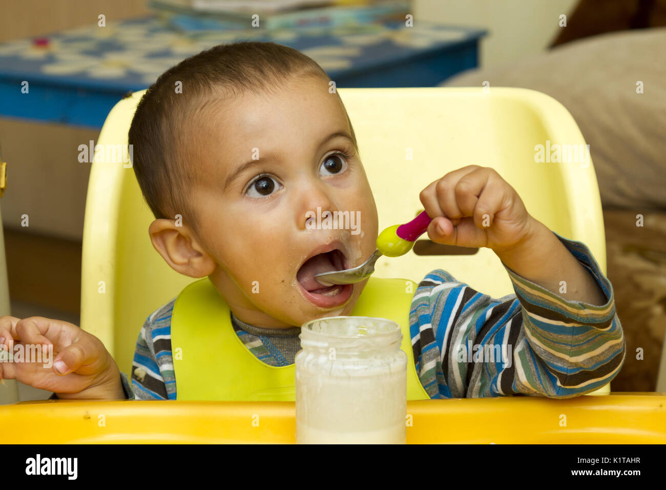 Little baby are eating indoor face eating Stock Photo - Alamy