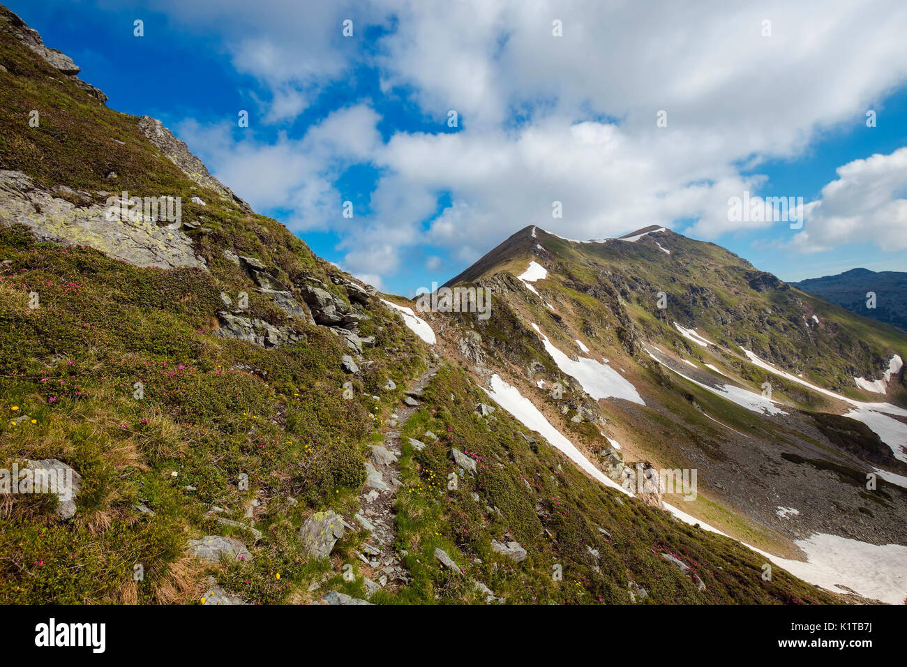 Majestic mountain chain landscape with path Stock Photo - Alamy