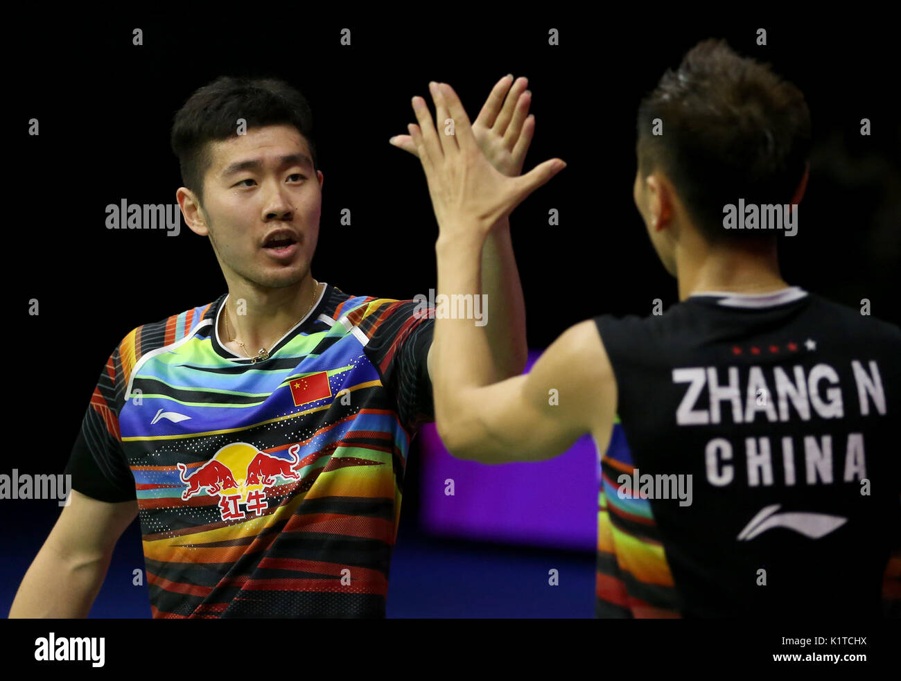 China's Liu Cheng (left) and Zhang Nan react after winning a point ...