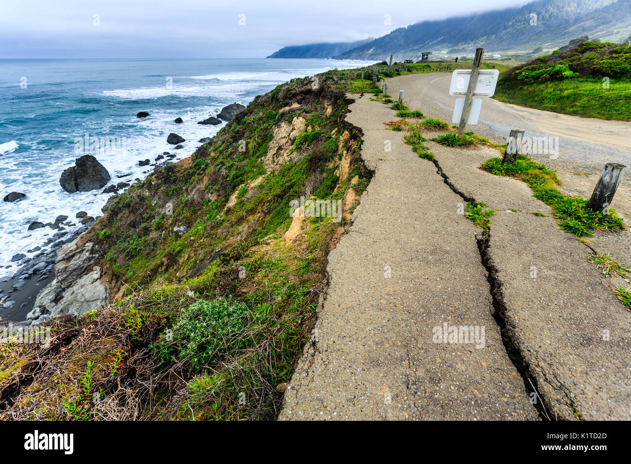 Erosion destruction clearly visible on lonely coast road Stock Photo ...