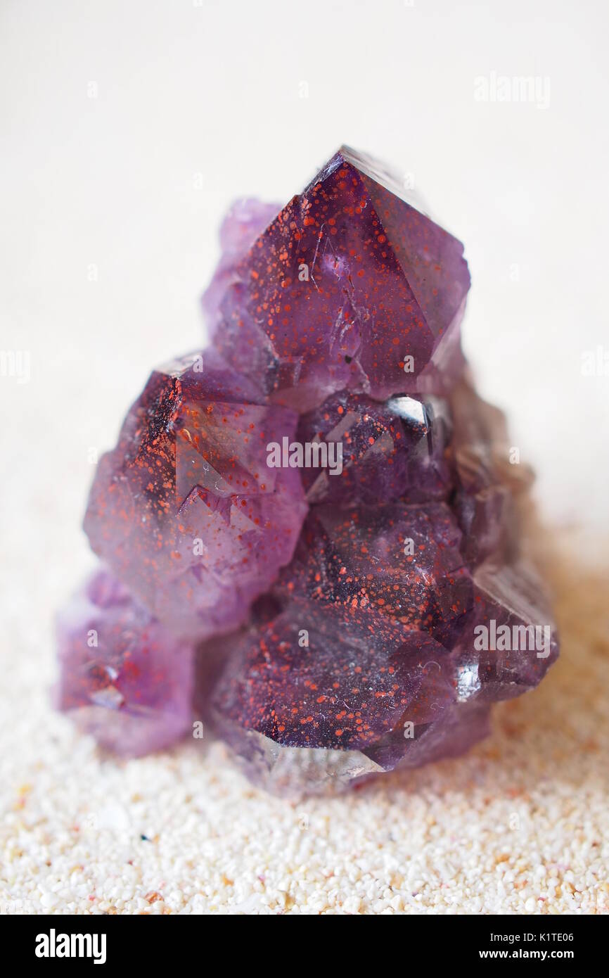 Canadian amethyst mined in Ontario, resting on a bed of sand Stock ...